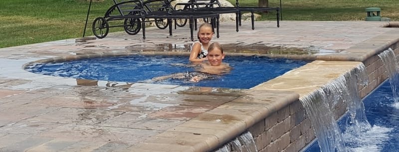 A Splash Pad Adds Big Value To Any PoolScape | Luxury Pools and Living